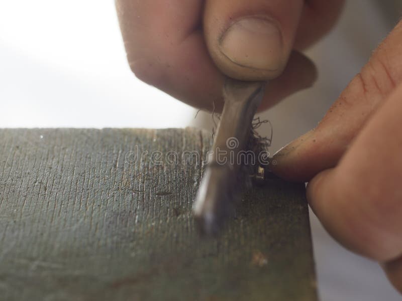 Craftsman Sharpening Tool Using Traditional Whetstone in Workshop Stock ...