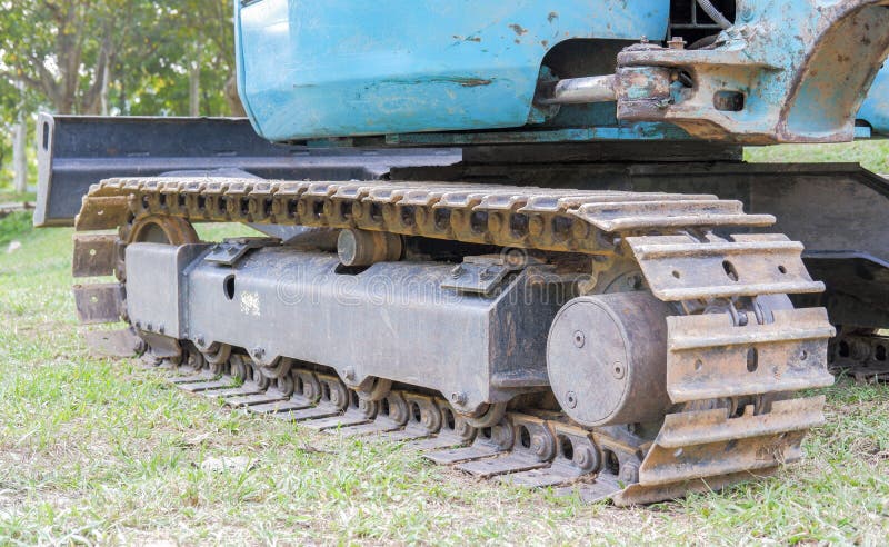 Close Up the Crawler of Backhoe Loader in Side View. on the Lawn Stock ...