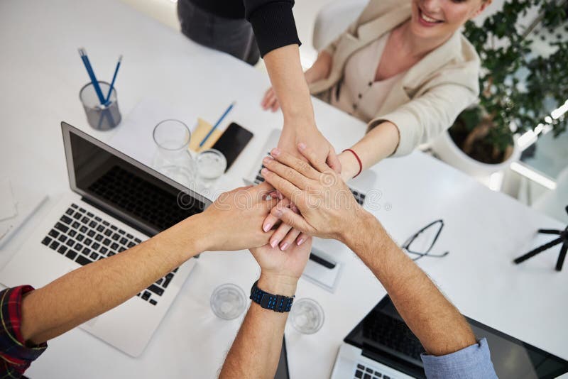 Business Colleagues Putting Their Hands Together in Office Stock Image ...