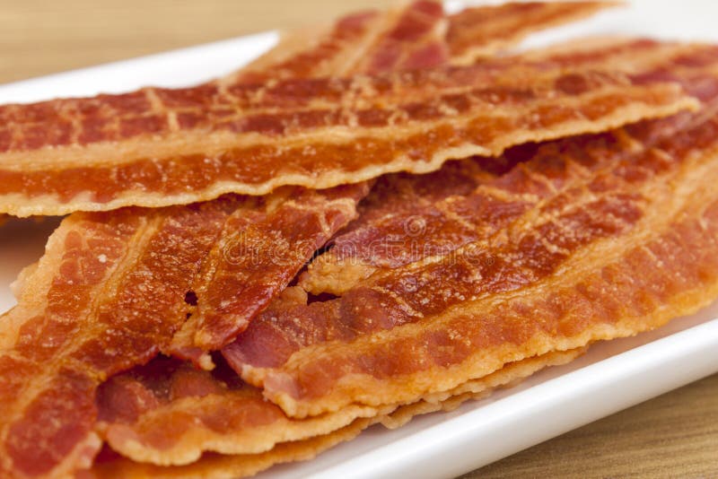 Close Up of Crispy Bacon Rashers on a Platter Stock Photo - Image of ...