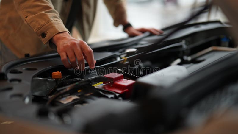 Close-up Cropped Shot of Unrecognizable Male Customer Looking at Engine ... Close-up Cropped Shot of Unrecognizable Male Customer Looking at Engine ...