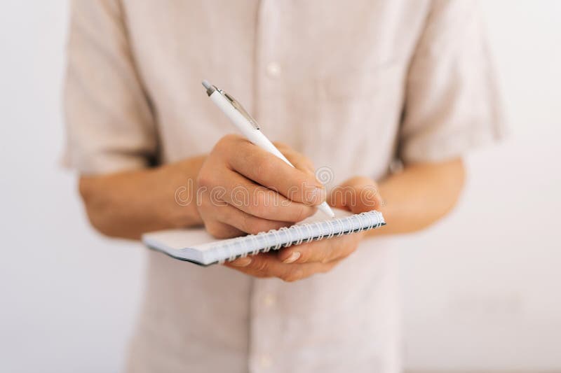 Close-up Cropped Shot of Unrecognizable Mature Male Making Notes ...