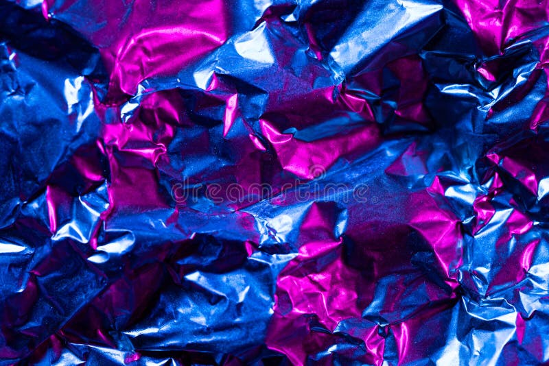 Close Up of Crumpled and Shiny Multi Coloured Foil with Copy Space ...