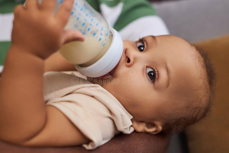 Close Up Cute Black Baby Boy Drinking Milk or Formula from Bottle Stock ...