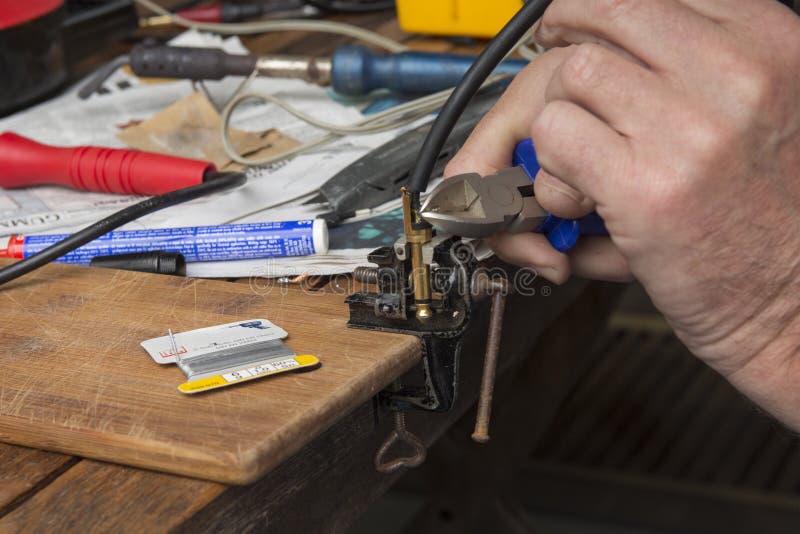 Cutting wire and soldering stock photo. Image of iron - 90218808
