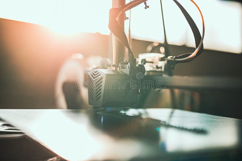 Close-up of a 3D Printer Head Working in the Rays of the Setting Sun ...