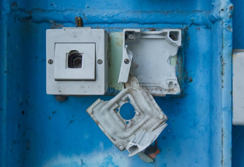 Damaged Electrical Outlet on Blue Wall Stock Photo - Image of ...