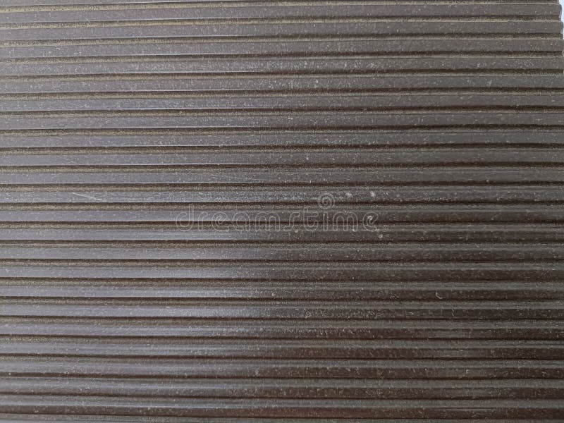 Close-Up of Dark Brown Composite Decking Panel with Grooved Texture ...