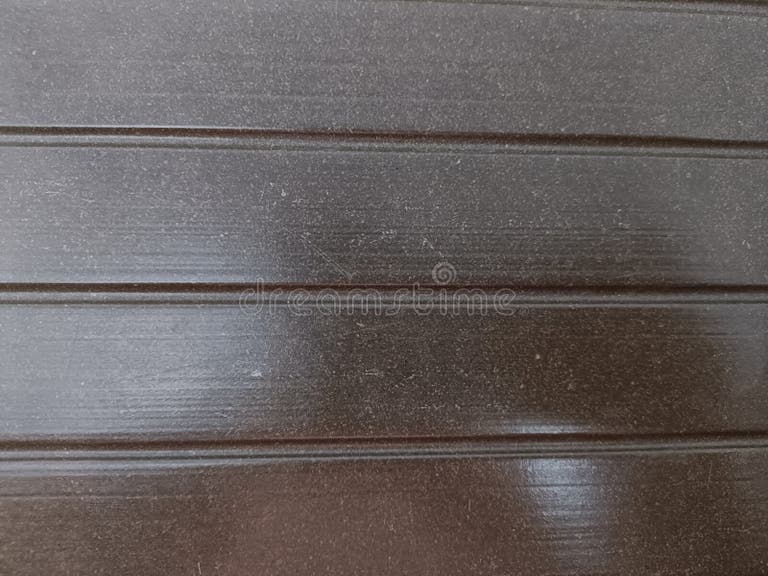 Close-Up of Dark Brown Composite Decking Panel with Grooved Texture ...