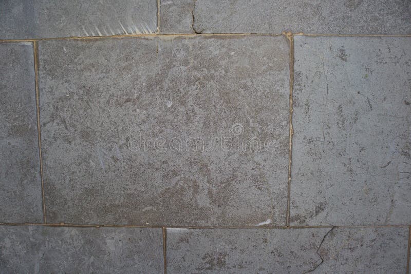 Close-up of a Dark Gray Rectangular Tile Floor with Wear Due To Time ...