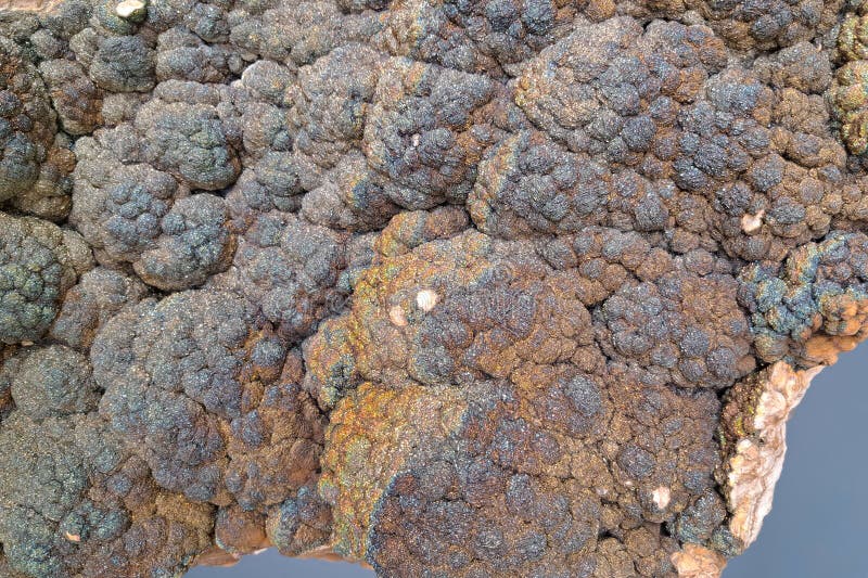 A Close-up of a Dark, Textured Mineral Surface with Bumpy, Rounded ...