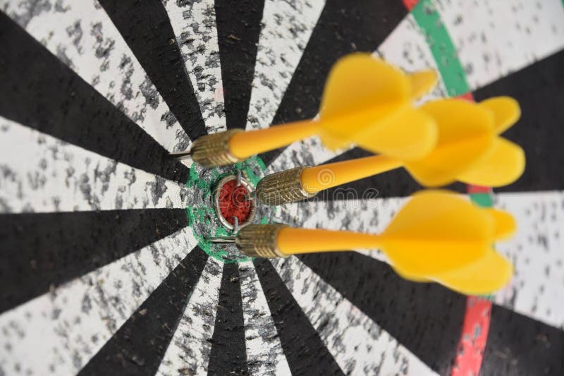 Close Up of Darts Clustered Together in a Dart Board Stock Image ...