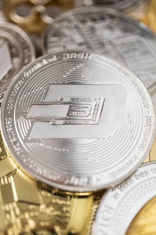 Close-up of Dash Physical Coin on Stack of Many Other Cryptocurrencies ...