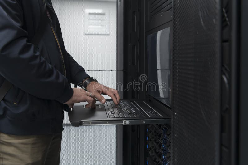 Close Up on Data Center Engineer Hands Using Keyboard on a ...