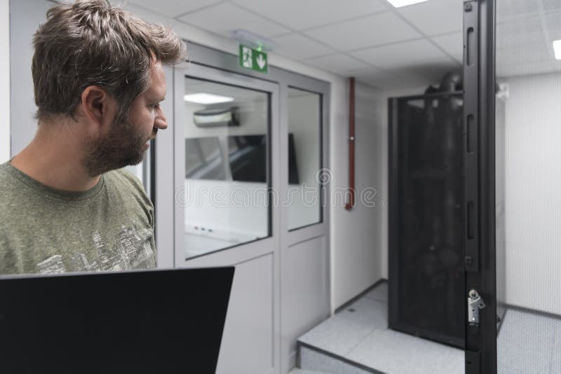 Close Up on Data Center Engineer Hands Using Keyboard on a ...