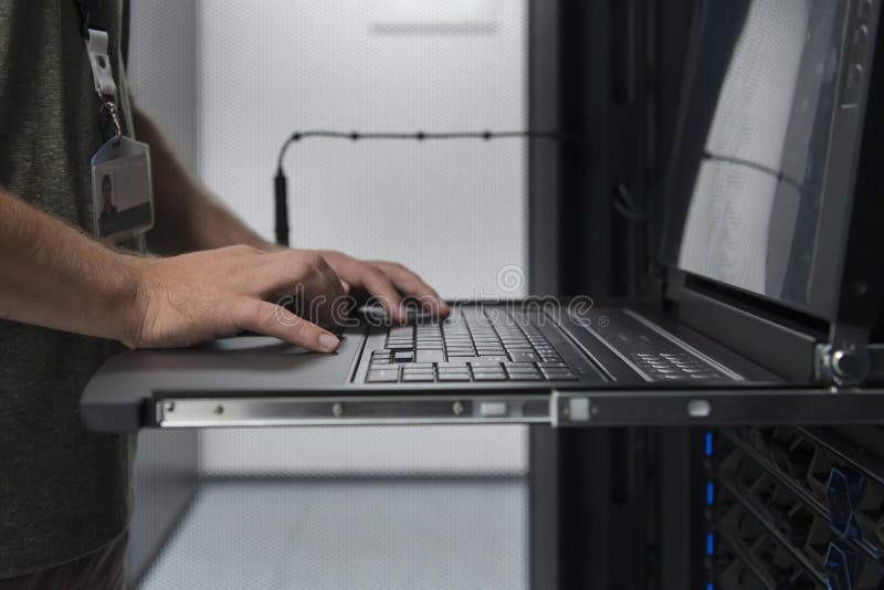 Close Up on Data Center Engineer Hands Using Keyboard on a ...