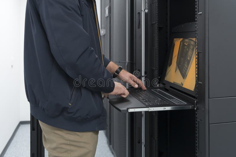 Close Up on Data Center Engineer Hands Using Keyboard on a ...