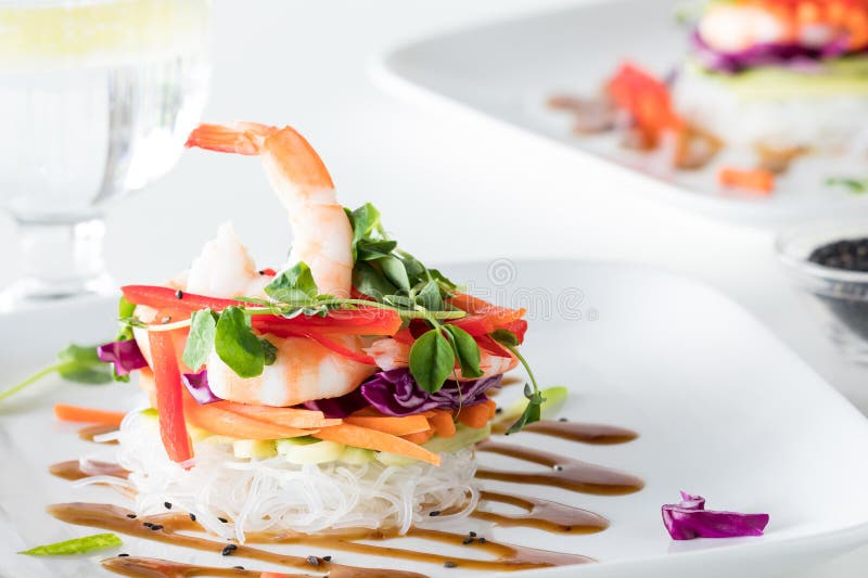 A Close Up of a Deconstructed Salad Roll into a Stack Salad with Asian ...