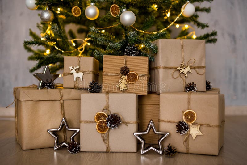 Close Up of Decorated Gift Boxes Under Christmas Tree Over Concrete ...