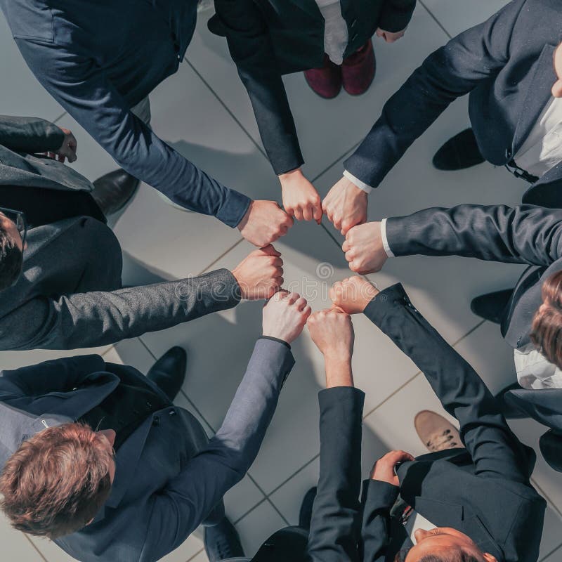 Close Up. a Dedicated Business Team Showing Their Unity Stock Photo ...