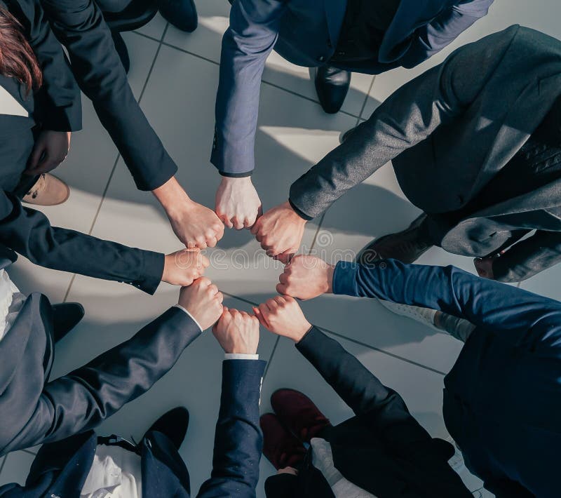 Close Up. a Dedicated Business Team Showing Their Unity Stock Photo ...