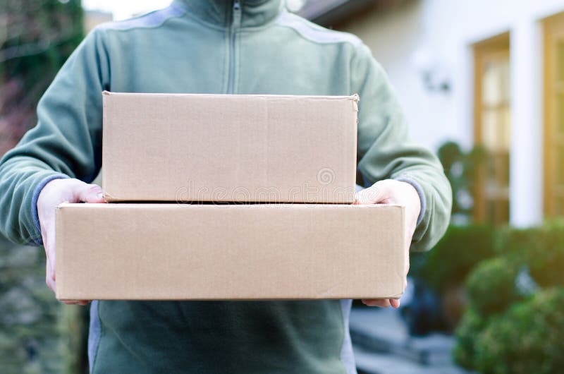 Close-up of Delivery Man Delivers Package Stock Photo - Image of ...