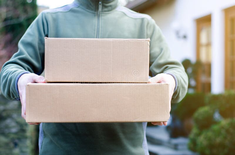 Close-up of Delivery Man Delivers Package Stock Image - Image of mail ...