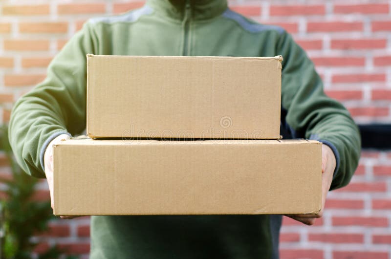 Close-up of Delivery Man Delivers Package Stock Image - Image of mail ...