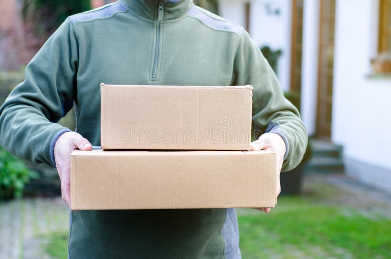 Close-up of Delivery Man Delivers Package Stock Photo - Image of carton ...