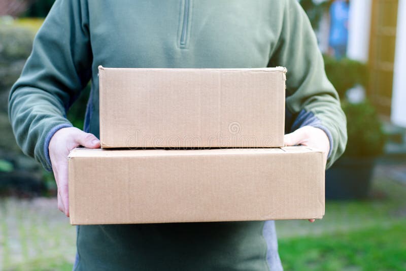 Close-up of Delivery Man Delivers Package Stock Photo - Image of ...