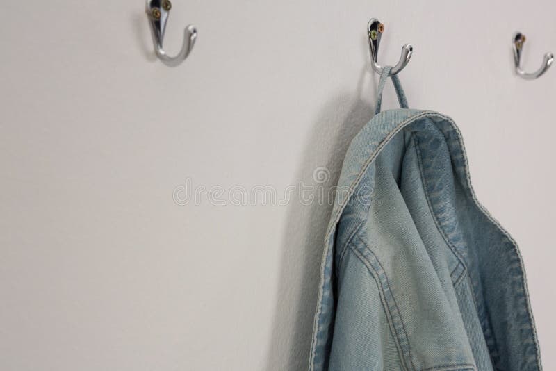 Denim Jacket Hanging on Hook Stock Photo - Image of people, hook: 103783712