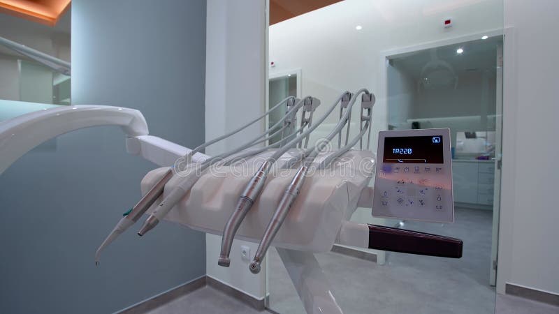 Close-up of Dental Instruments Including Handpieces, Air Scaler, and ...