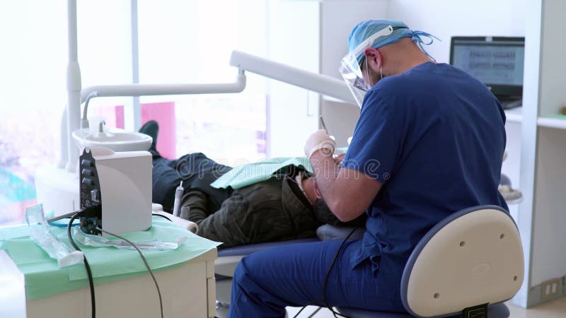 A Dentist Operating with Digital Tooth Model and Medical Structure ...