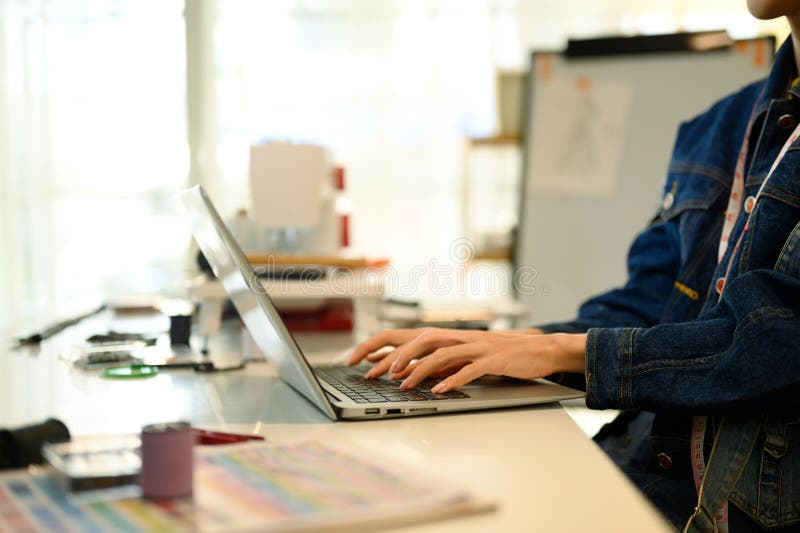 Close Up of Designer Hands Typing on Laptop in a Creative Workspace ...