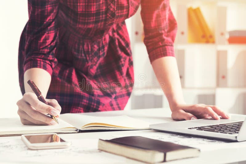 Close Up of a Designer in Red at Work Stock Image - Image of binder ...
