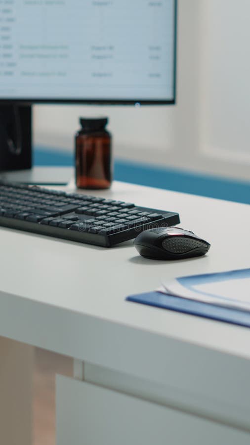 Close Up of Desk with Medical Documents and Computer Stock Photo ...