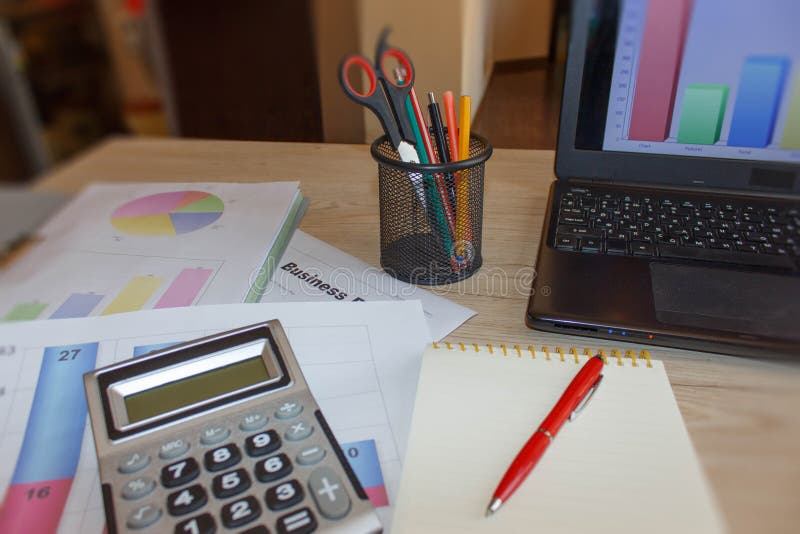 Close Up Detail View of a White Work Desk with a Laptop Computer and a ...
