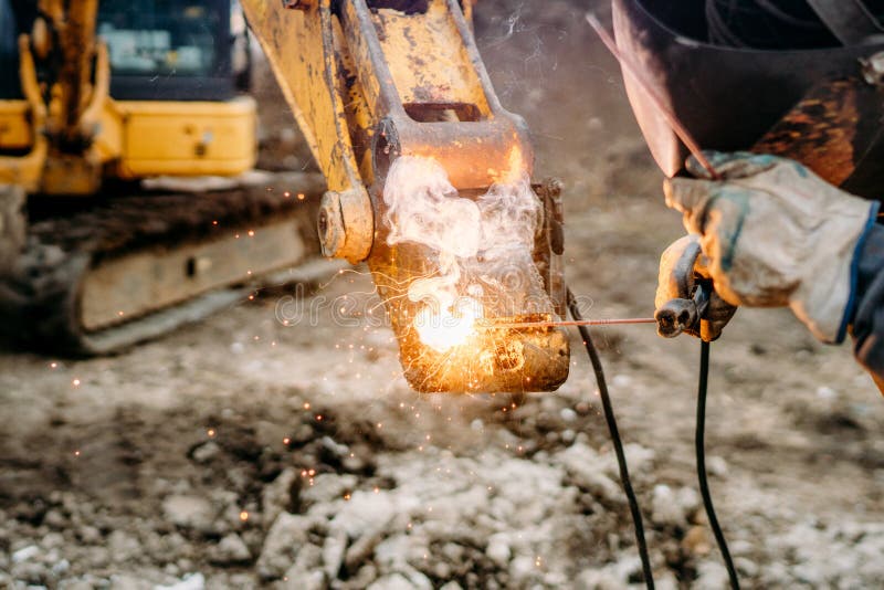 Details of Mechanic, Worker Welding Excavator Stock Image - Image of ...