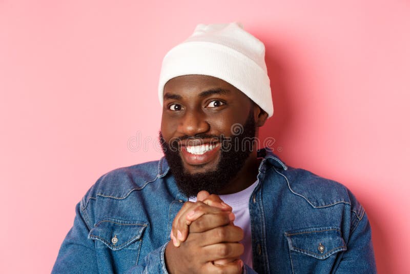 Close Up Of Devious And Happy African American Man Smiling Satisfied