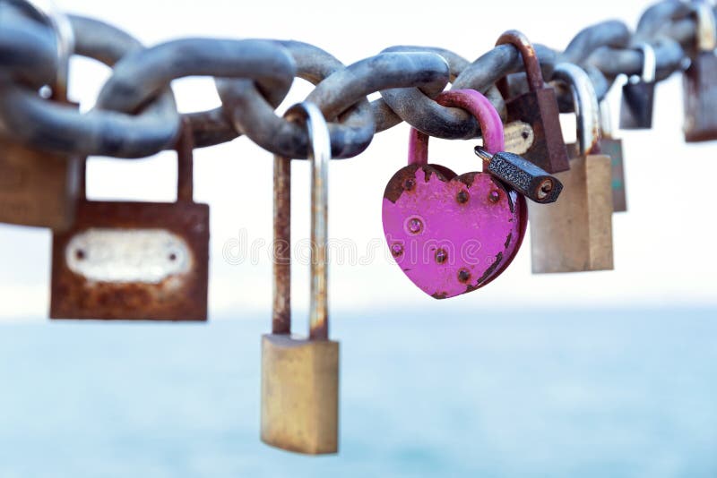Close Up of Different Colorful Love Locks on Chain on Blurred Sea ...