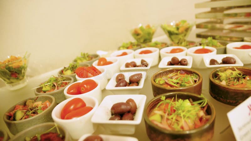 Close-up of Different Types of Appetizers in Small Bowls on a Buffet ...