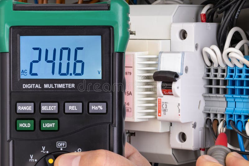Voltage Measurement with Digital Multimeter in Electrical Panel Stock ...