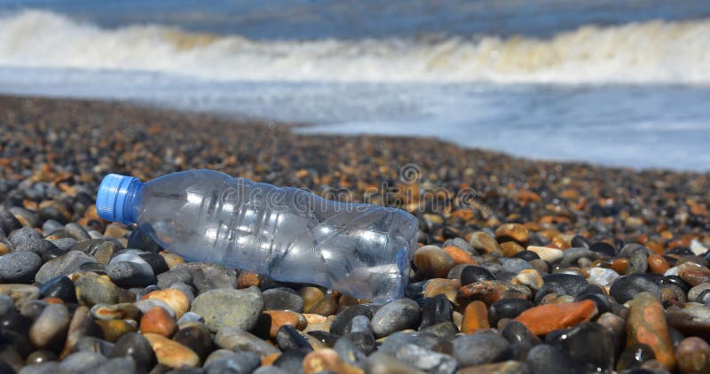 Close Up of Discarded Plastic Bottle Washed Up on Pebble Beach B Stock ...