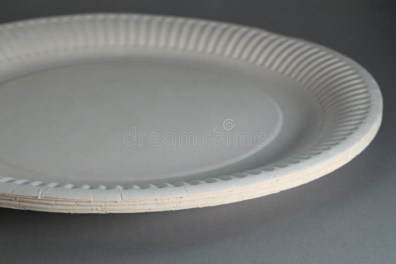 Close-up of Disposable White Paper Plates on Table. Soft Focus Stock ...