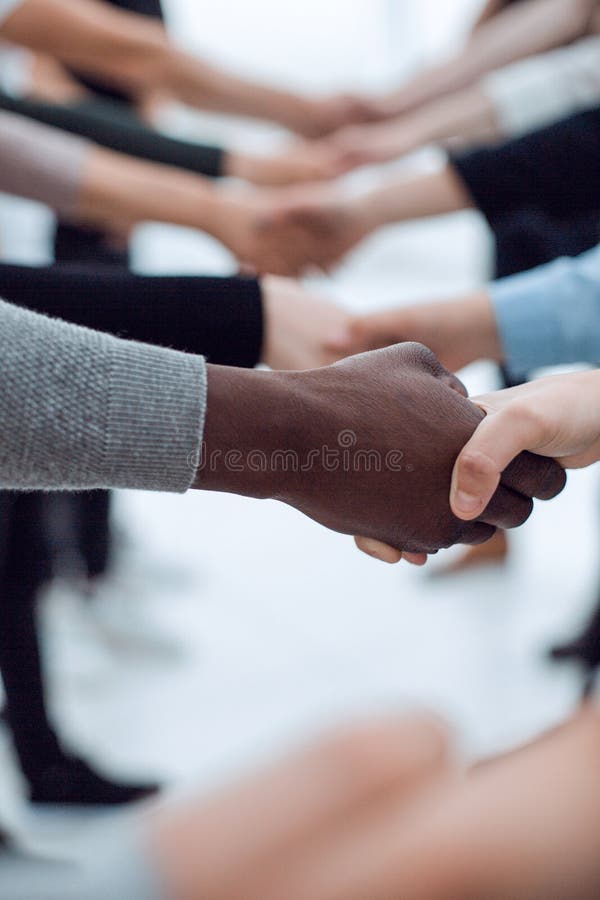 Close Up. Diverse Young People Shaking Hands with Each Other. Stock ...