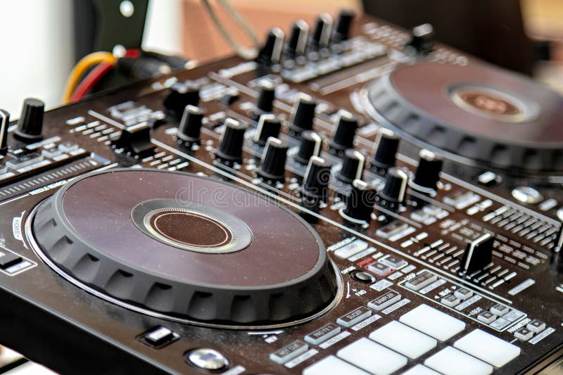 A Close Up of a Dj Mixer with Two Turntables on Top of it Stock Photo ...