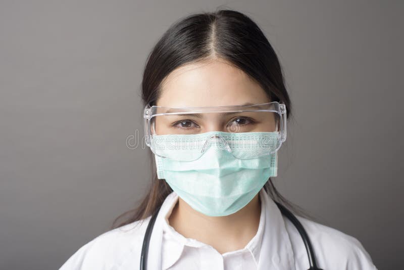 Doctor with Face Mask Checking Health of Patient at Home Stock Photo ...