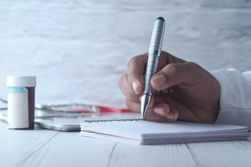 Close Up of Doctor Hand Writing on Paper Stock Photo - Image of ...