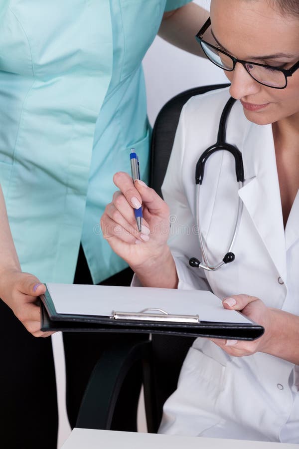 Close-up of Doctor and Her Assistant Stock Image - Image of medicine ...