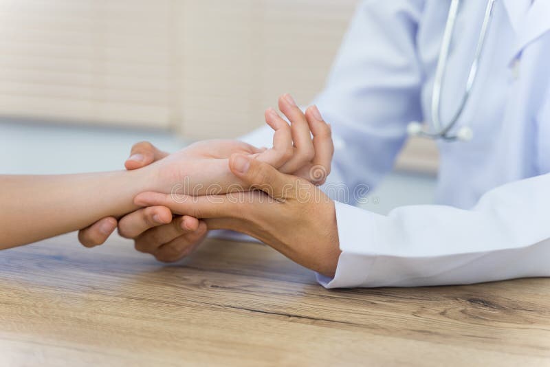 Close Up Of A Doctor Holding The Patient Hands Doing Basic Medical ...